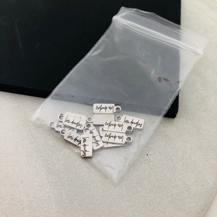 Jewelry Tags | Laser Engraved Logo Tags | Lora Douglas Jewelry